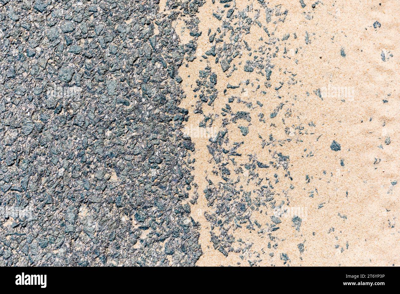 Asphalt road with sand Stock Photo - Alamy