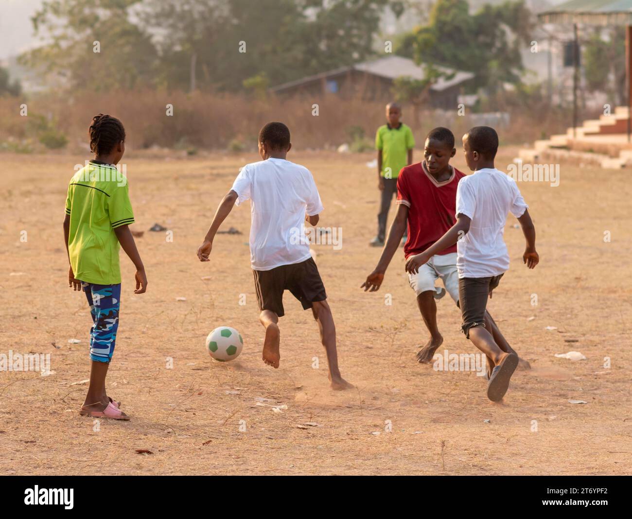 Childrens playing football Stock Photo - Alamy