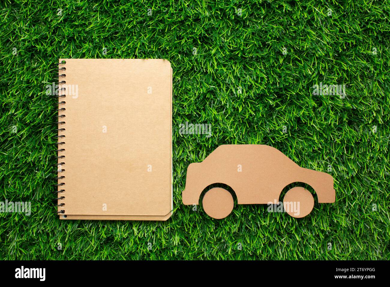 Cartoon car notebook grass Stock Photo - Alamy