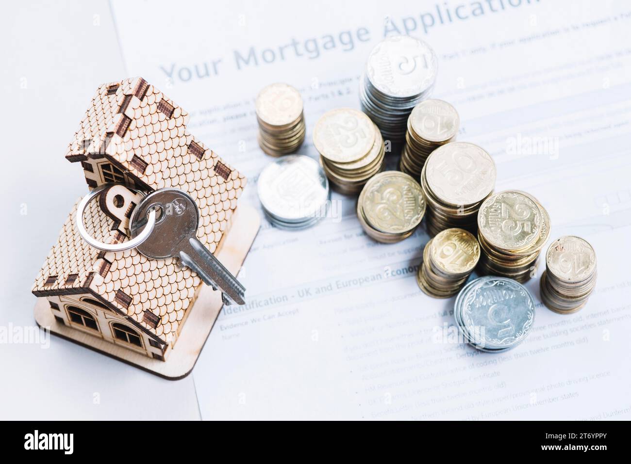 Coins key sheet mortgage application Stock Photo - Alamy