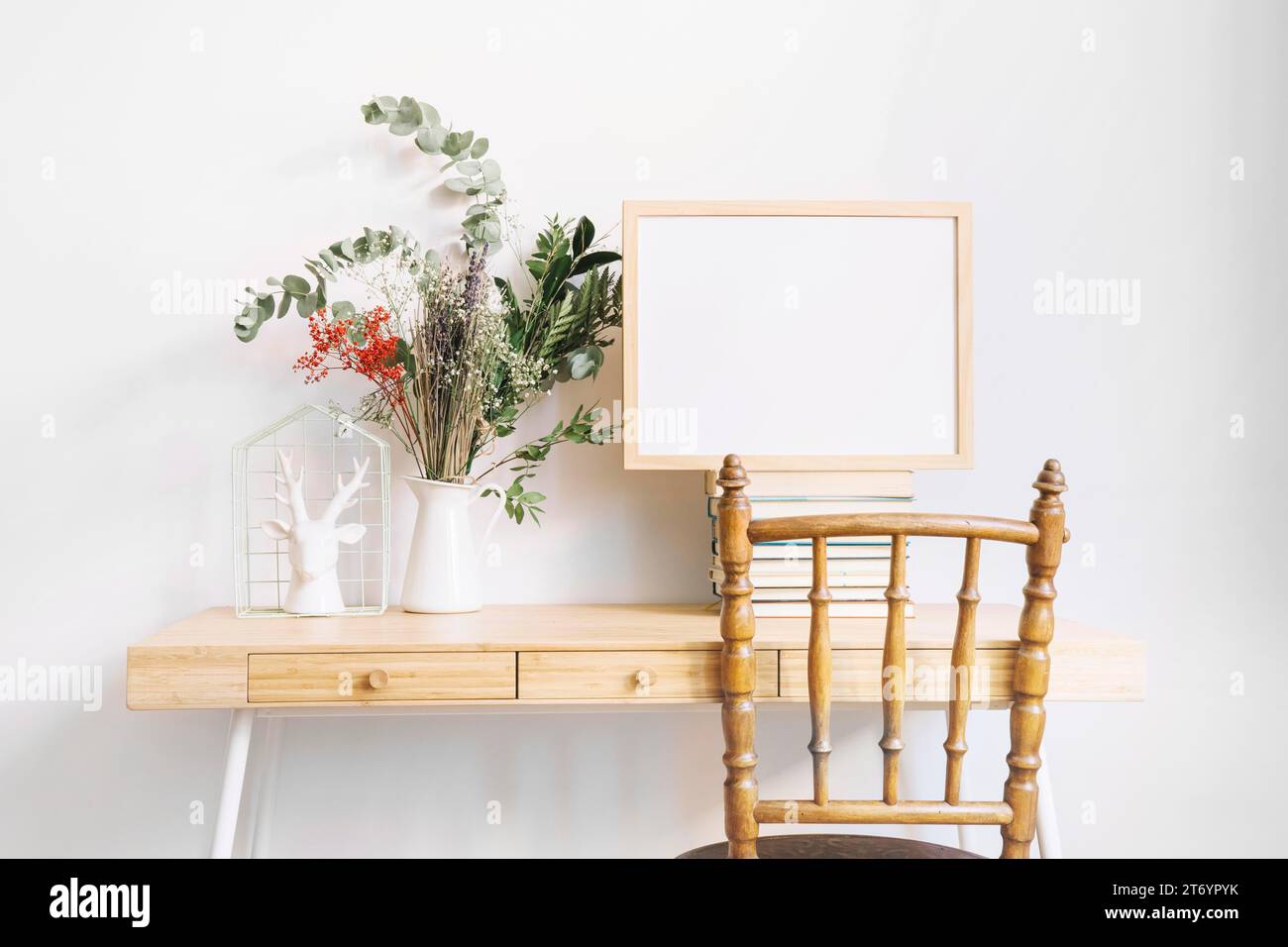 Decorative desk with frame plant Stock Photo - Alamy