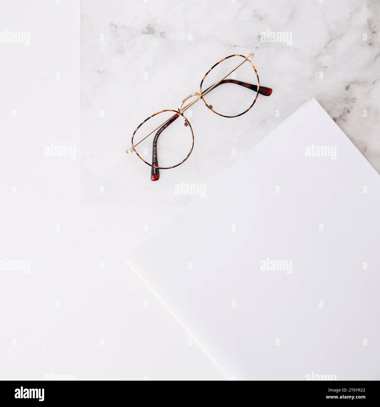 Eyeglasses white paper textured white backdrop Stock Photo - Alamy