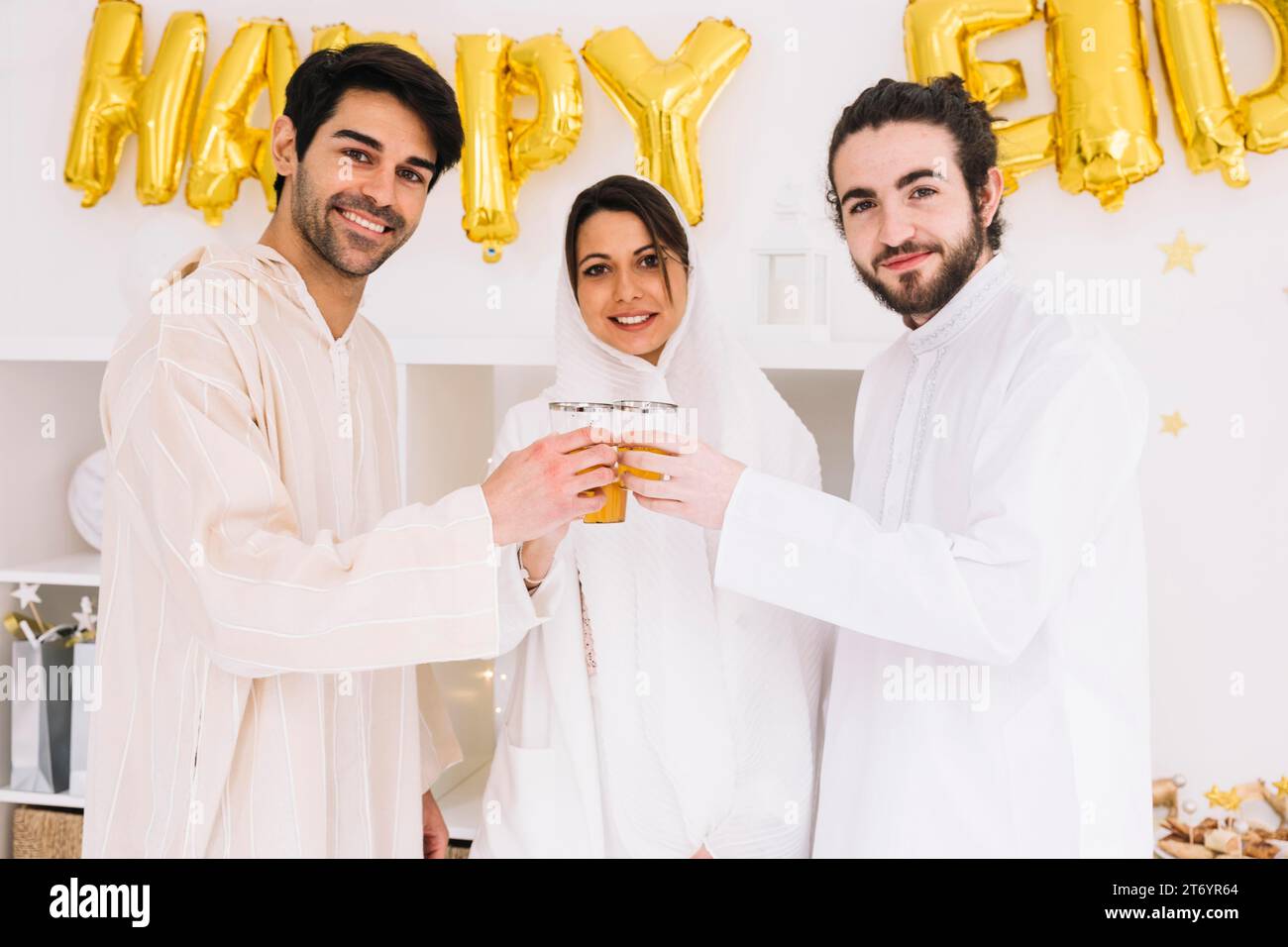 Eid al fitr concept with friends drinking tea Stock Photo - Alamy