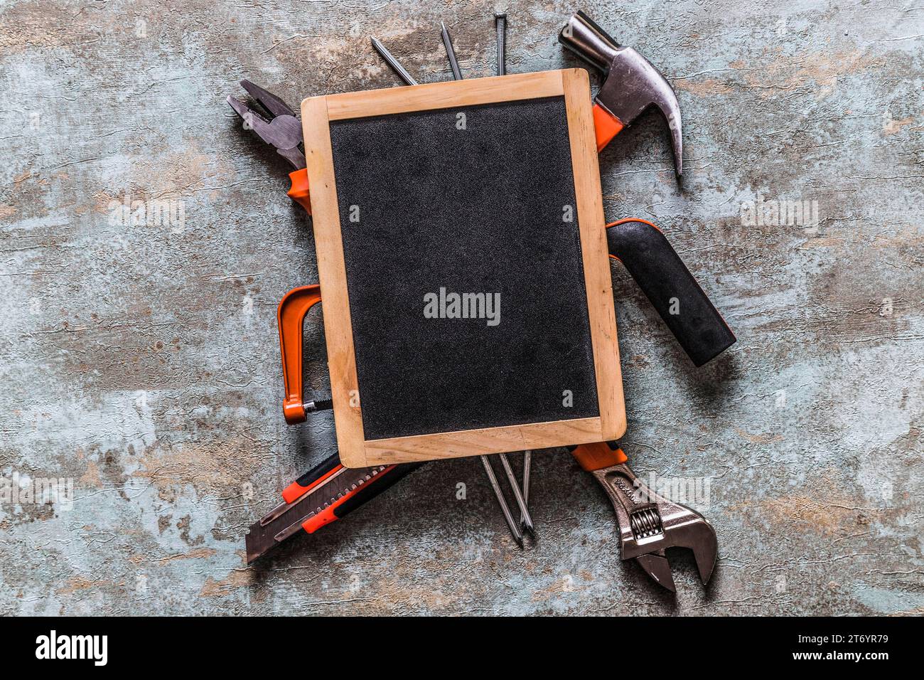 Elevated view blank slate various worktools Stock Photo - Alamy