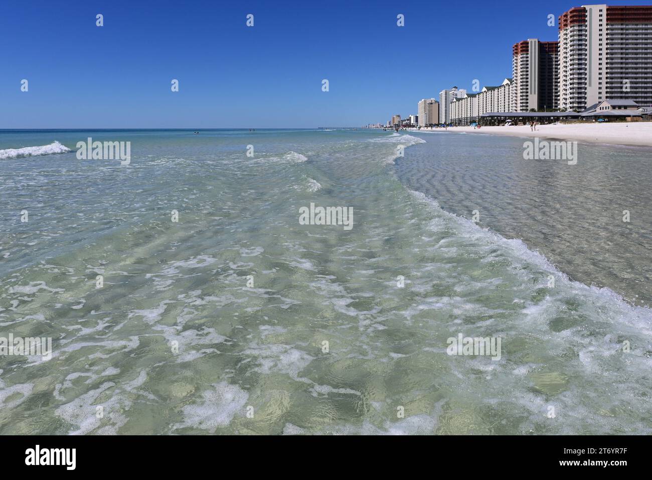 White sand beach, crystal clear water and beachfront residential ...