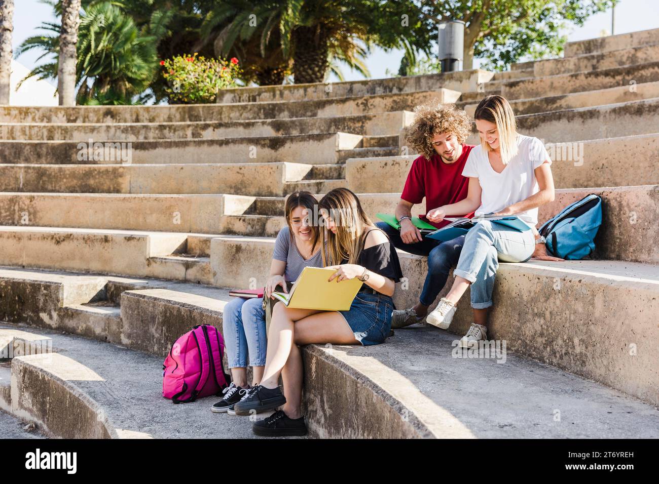 Friends studying together old stadium Stock Photo - Alamy