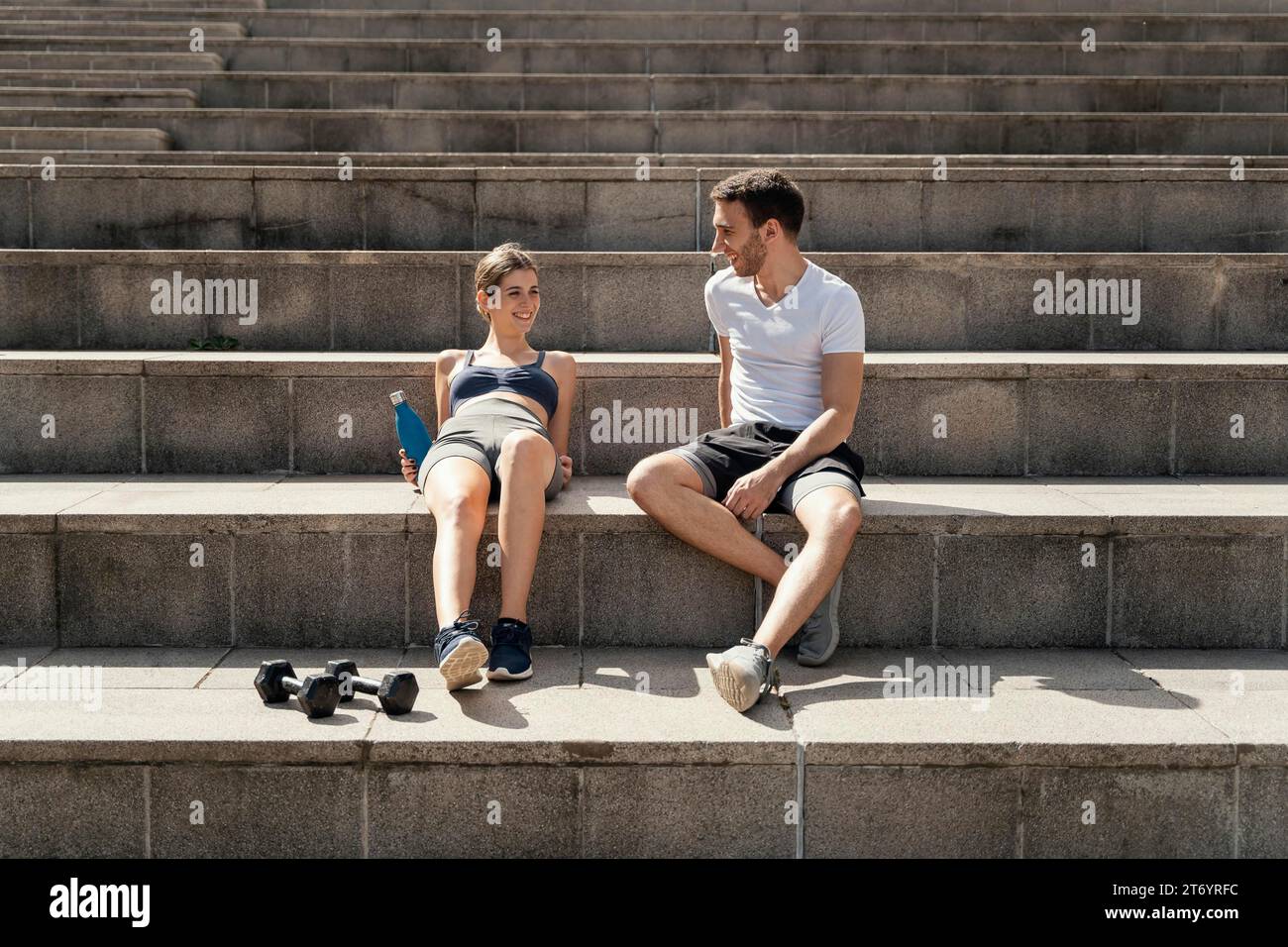 Front view man woman resting steps while exercising Stock Photo - Alamy
