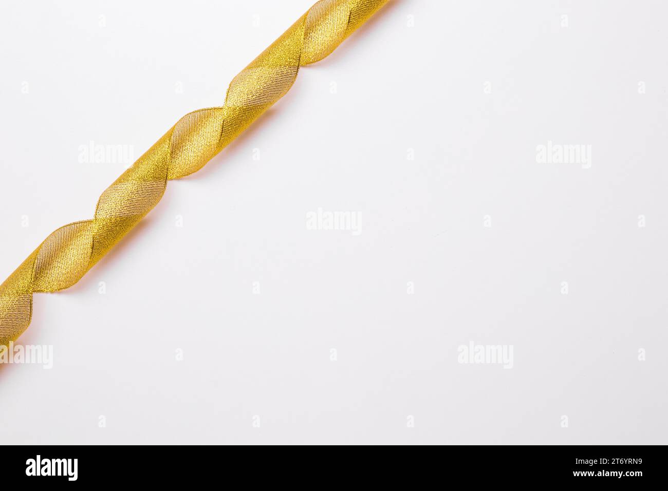Golden twisted ribbon background Stock Photo - Alamy