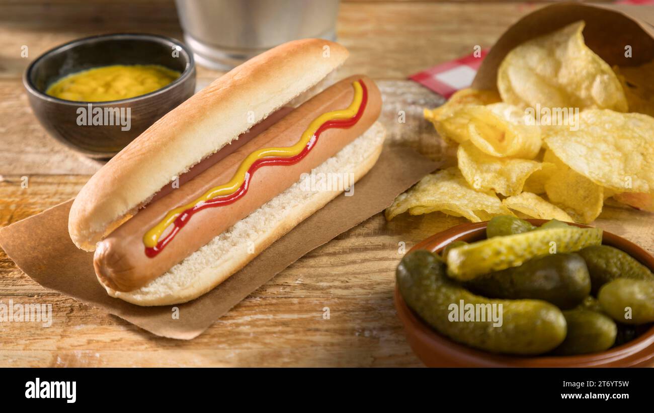 High view hot dog with pickles chips Stock Photo - Alamy