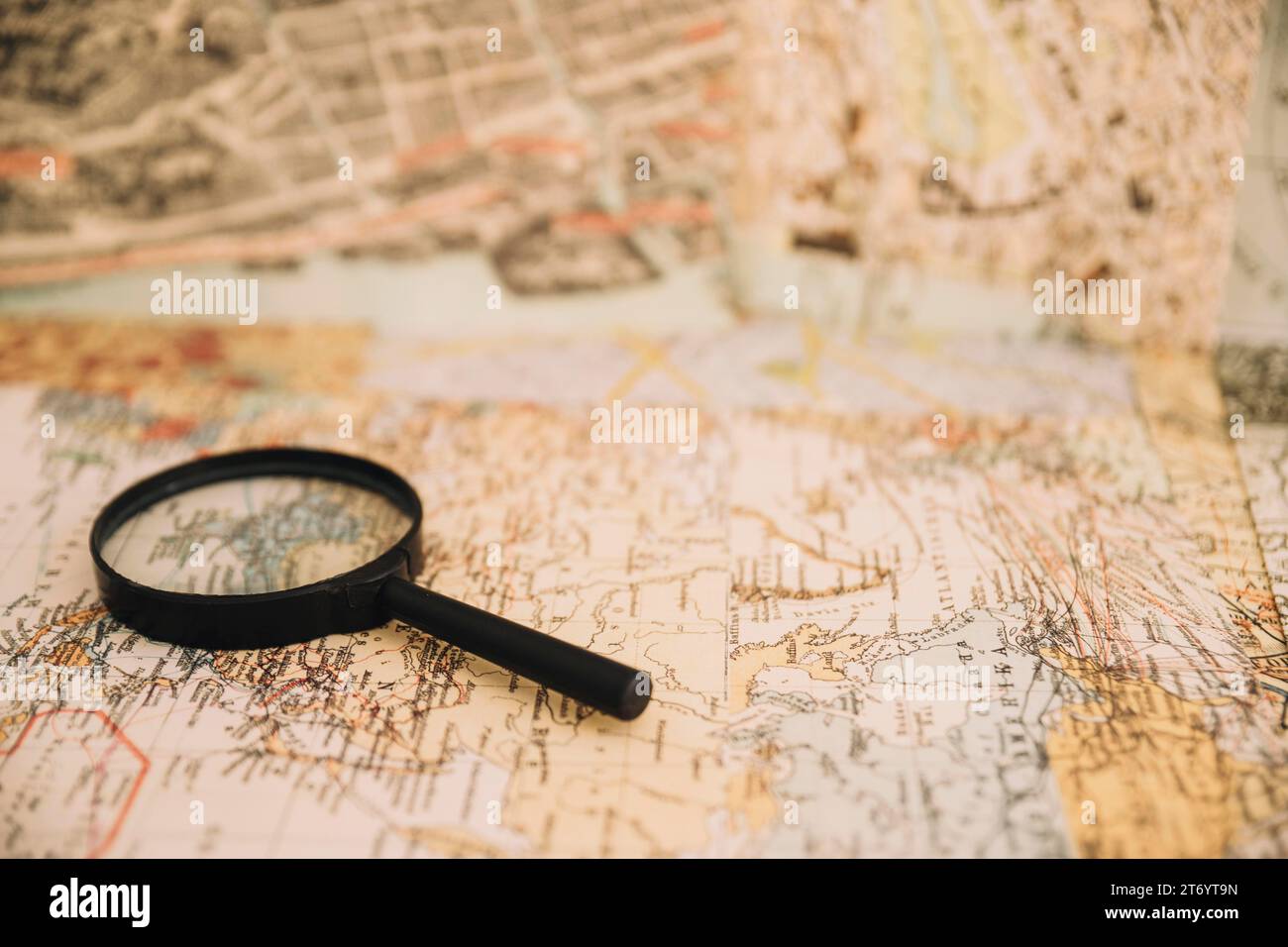 Magnifying glass old map Stock Photo - Alamy