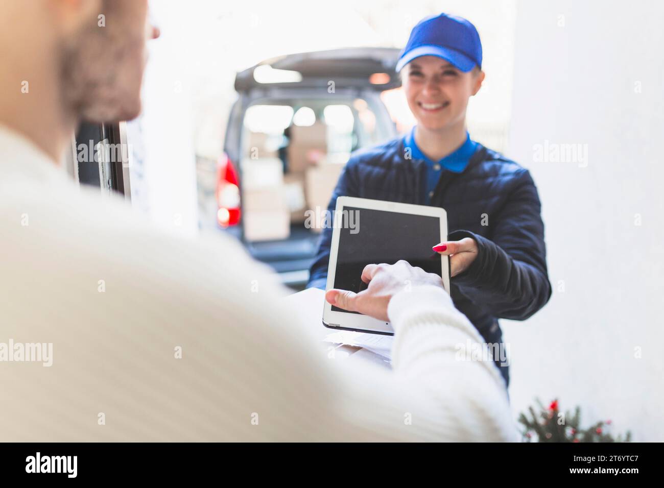 Delivery man giving package customer hi-res stock photography and ...