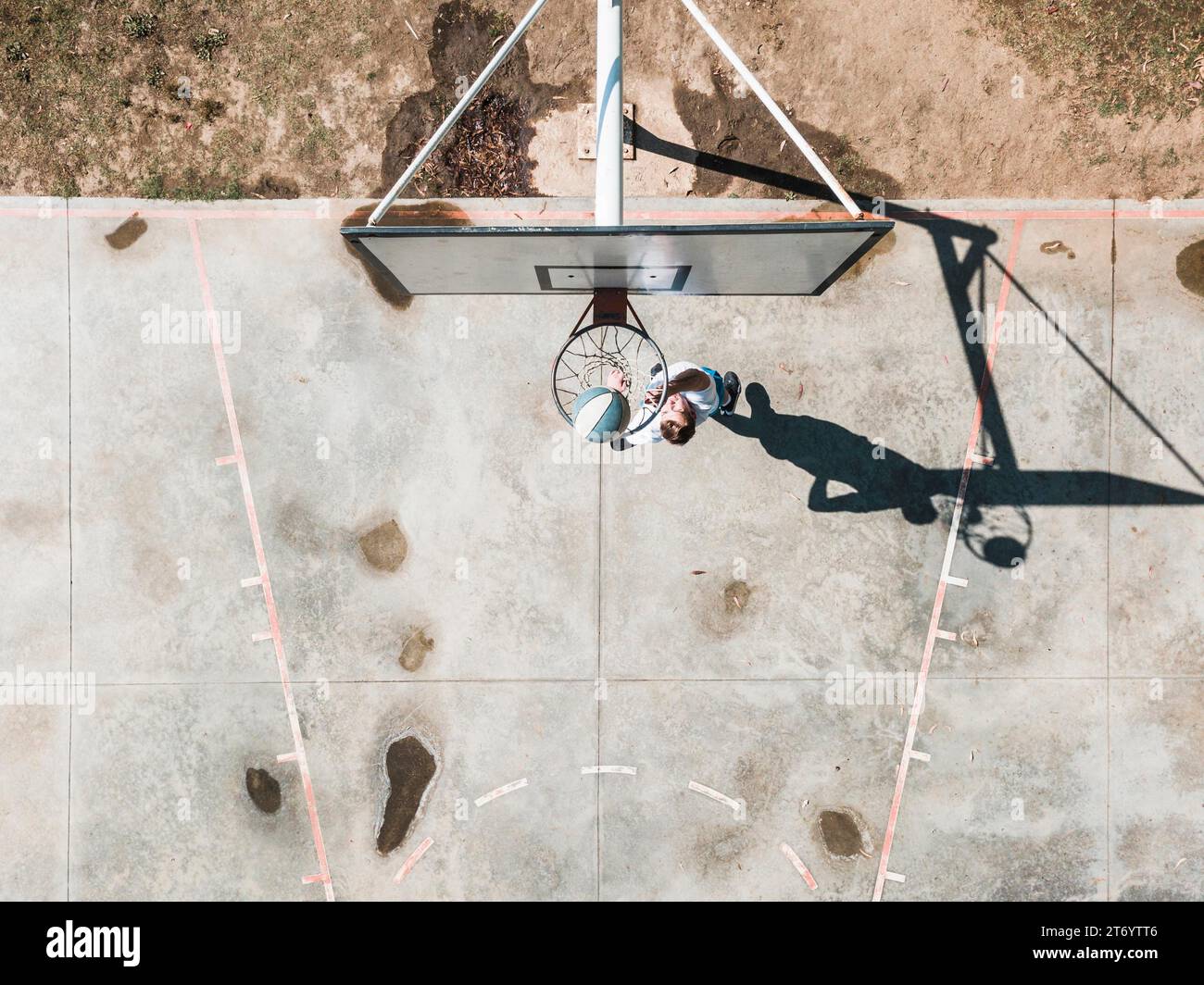 Overhead view man throwing ball basketball Stock Photo - Alamy