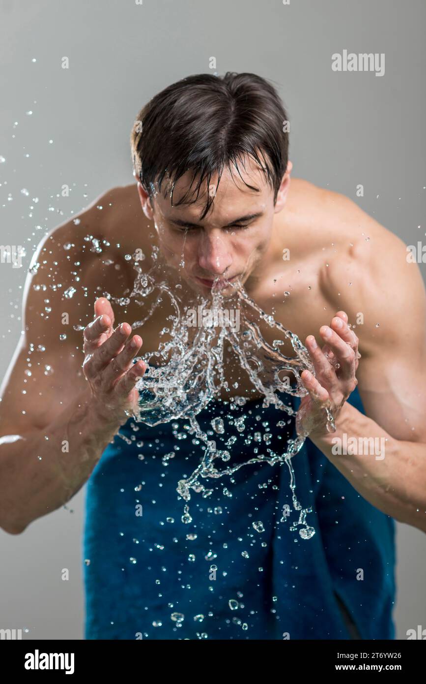 Portrait man washing his face Stock Photo - Alamy