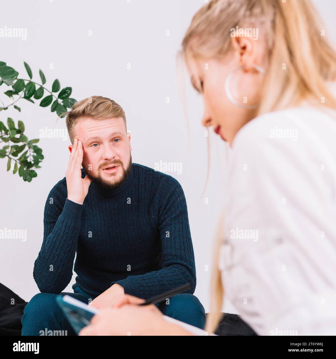 Portrait depressed male patient talking with female psychologist Stock ...