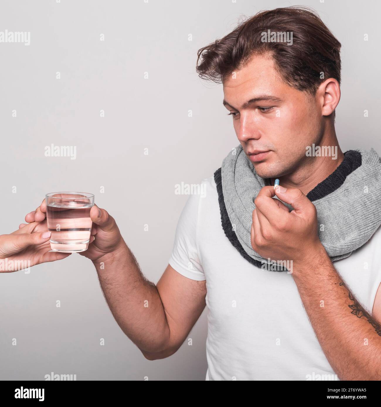 Sick man holding glass water from person s hand taking capsule Stock ...