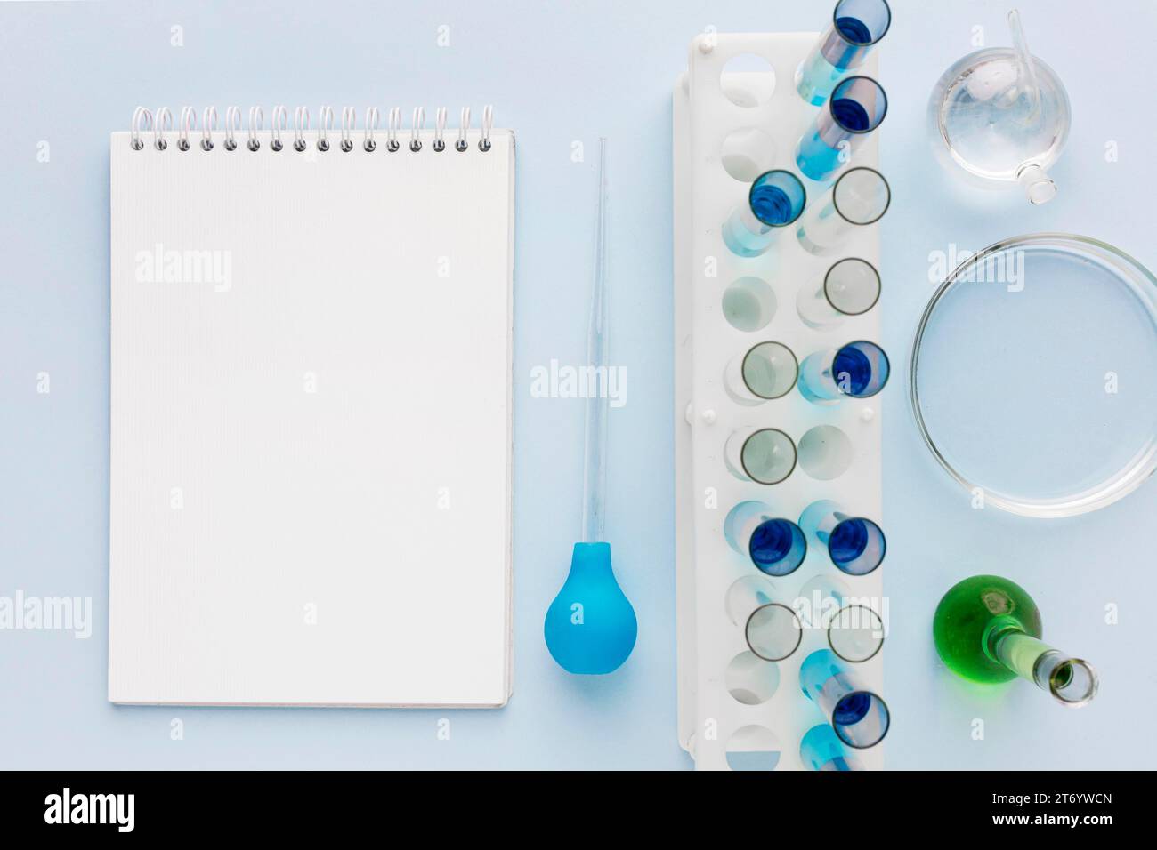 Science elements lab with empty notepad Stock Photo - Alamy