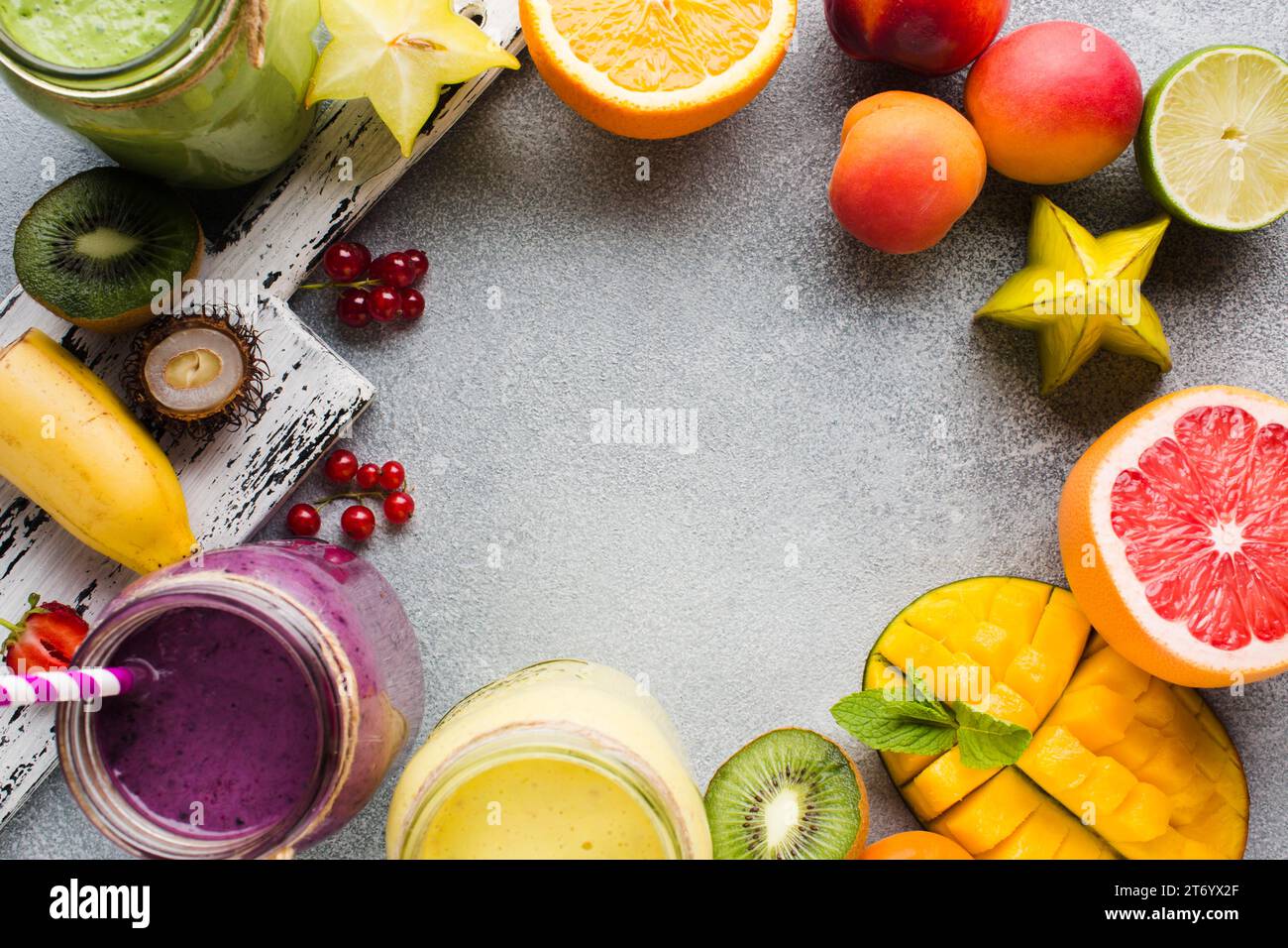 Top view healthy fruit smoothies frame Stock Photo - Alamy