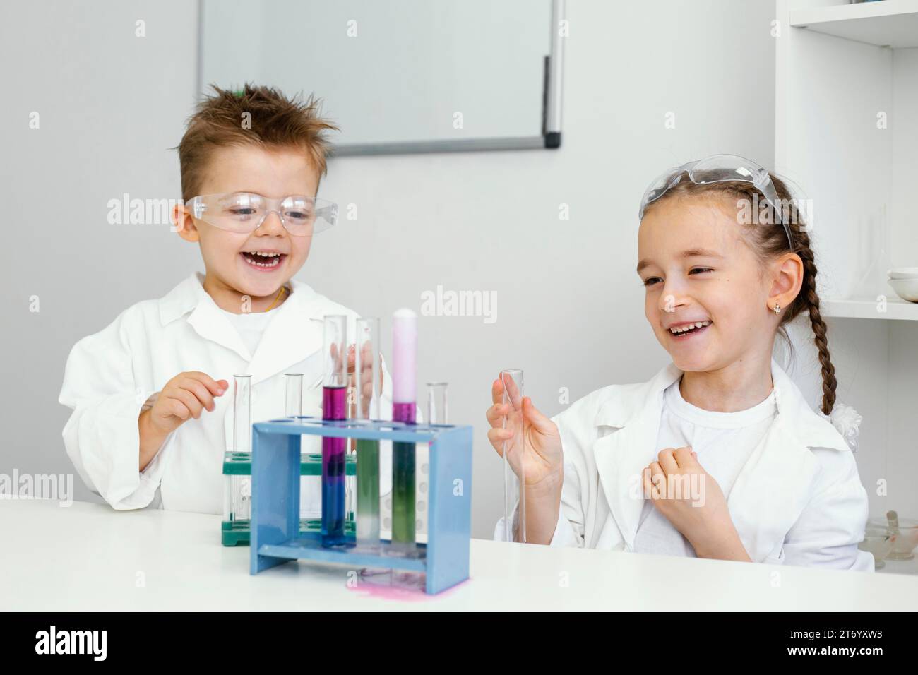 Young boy girl scientists having fun doing experiments laboratory Stock ...