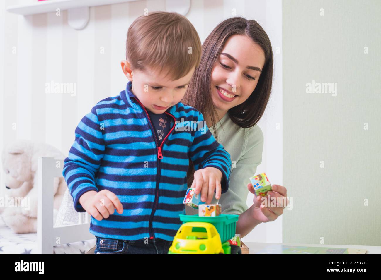 Young woman spending time with son Stock Photo - Alamy