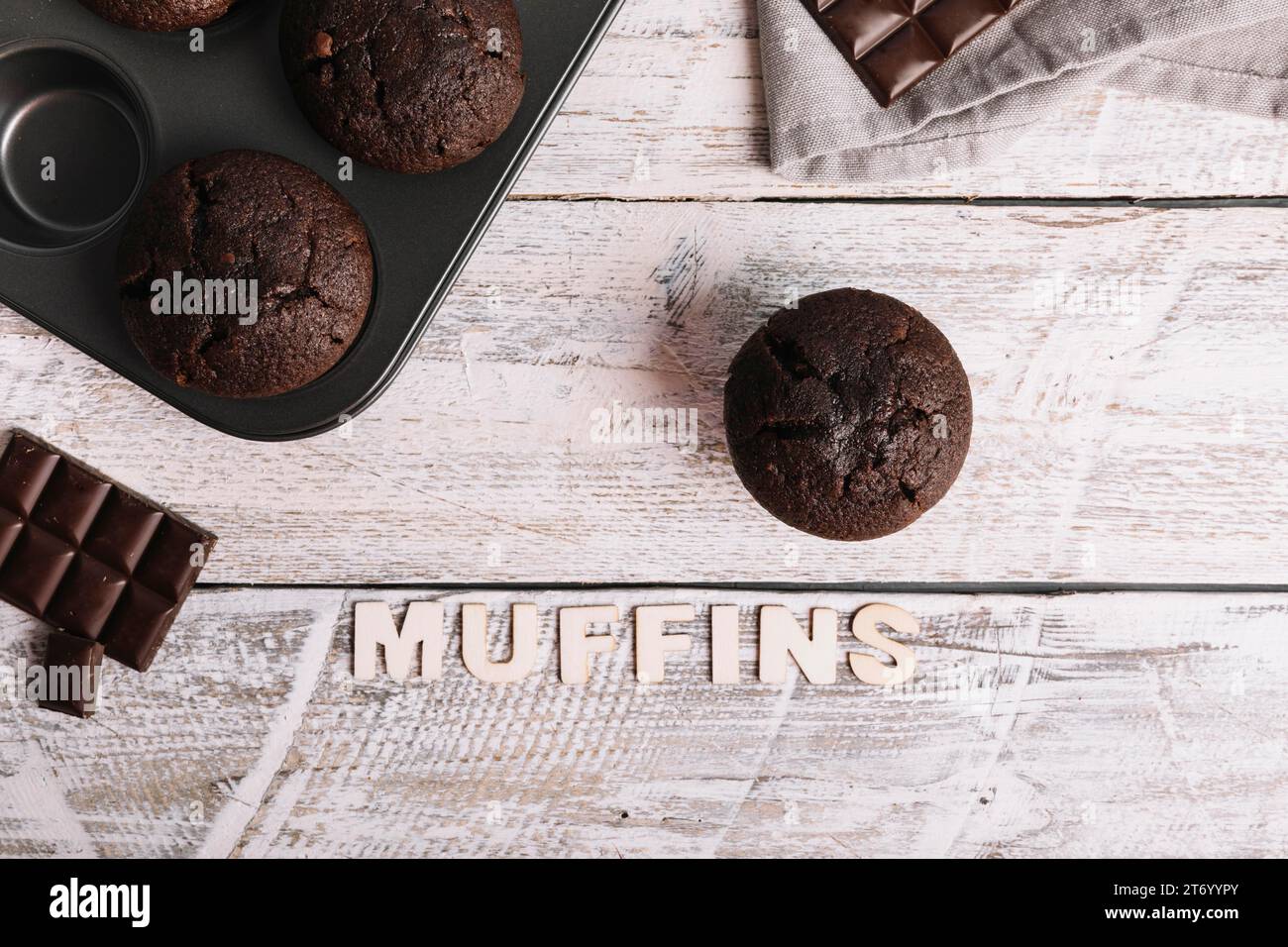 Chocolate cupcake white wooden table with muffin text Stock Photo - Alamy
