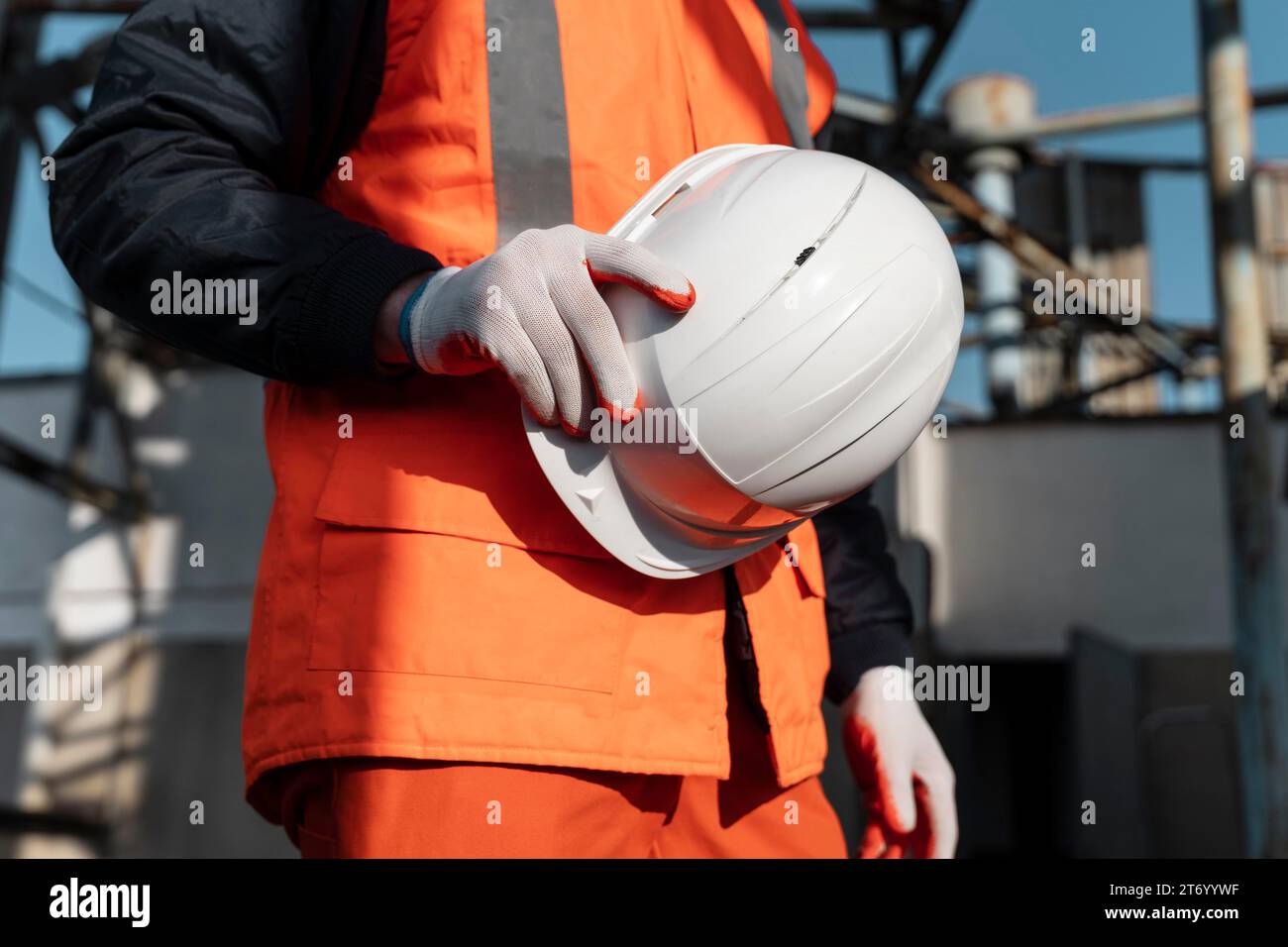 Close up hand holding safety helmet Stock Photo - Alamy