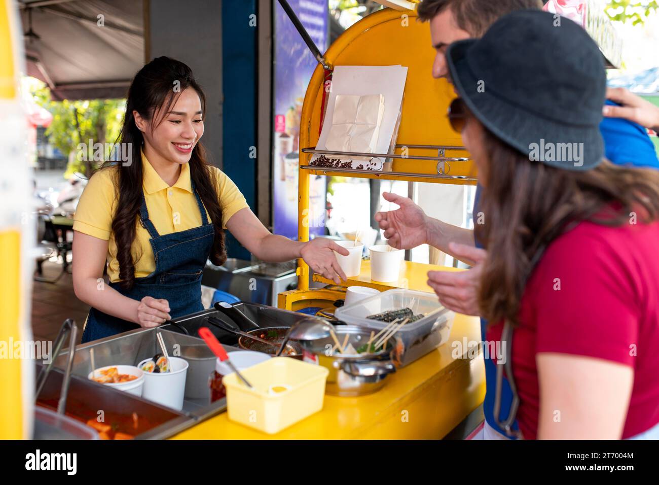 Close up woman serving customers Stock Photo - Alamy