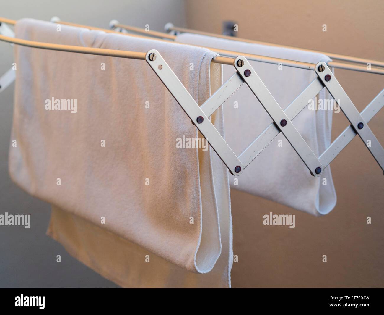 Close up white towels drying line Stock Photo - Alamy