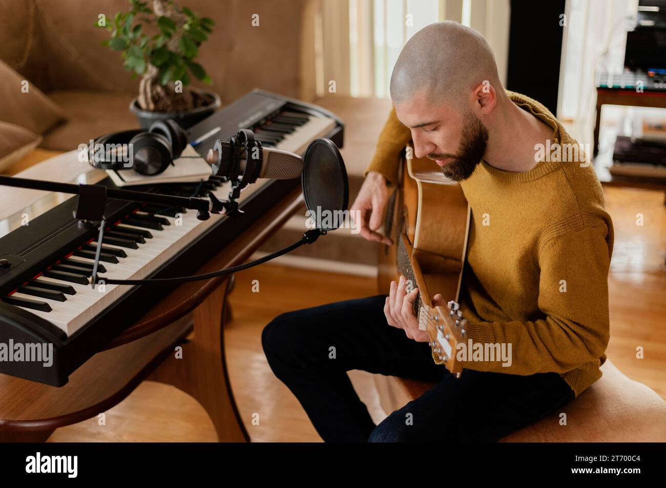 Creative musician practicing indoors Stock Photo - Alamy