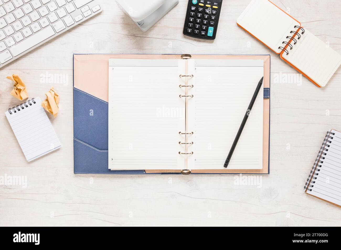 Desktop with opened organizer Stock Photo - Alamy