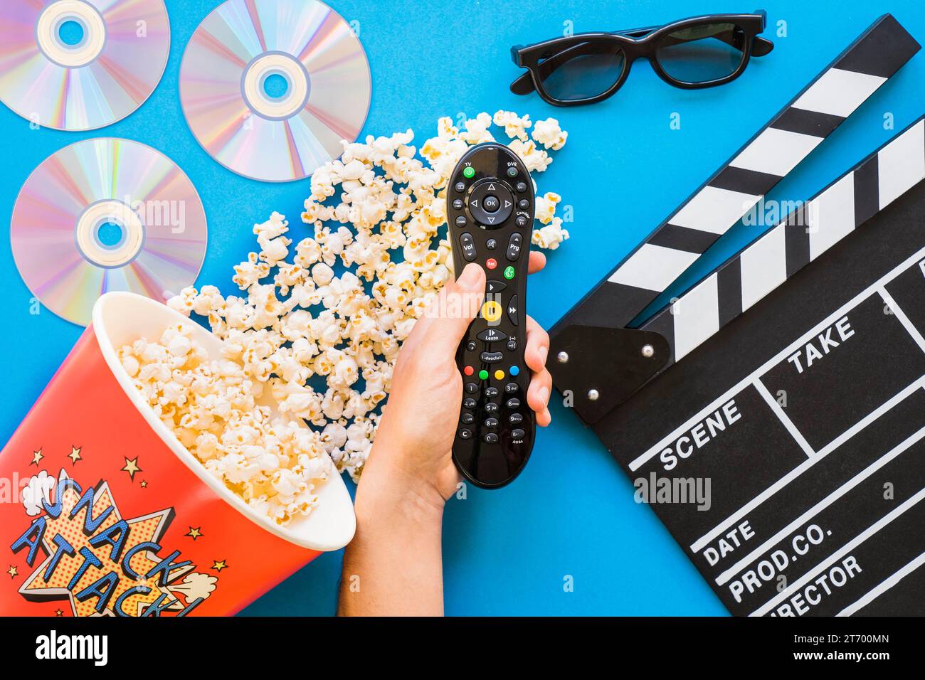 Film concept with hand holding remote control Stock Photo - Alamy