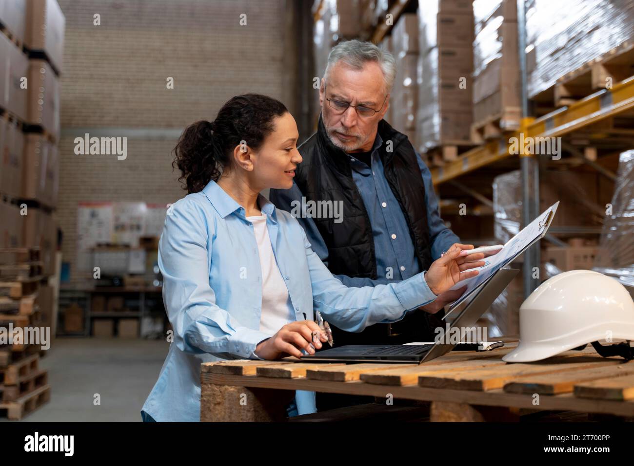 Employees working warehouse 4 Stock Photo - Alamy