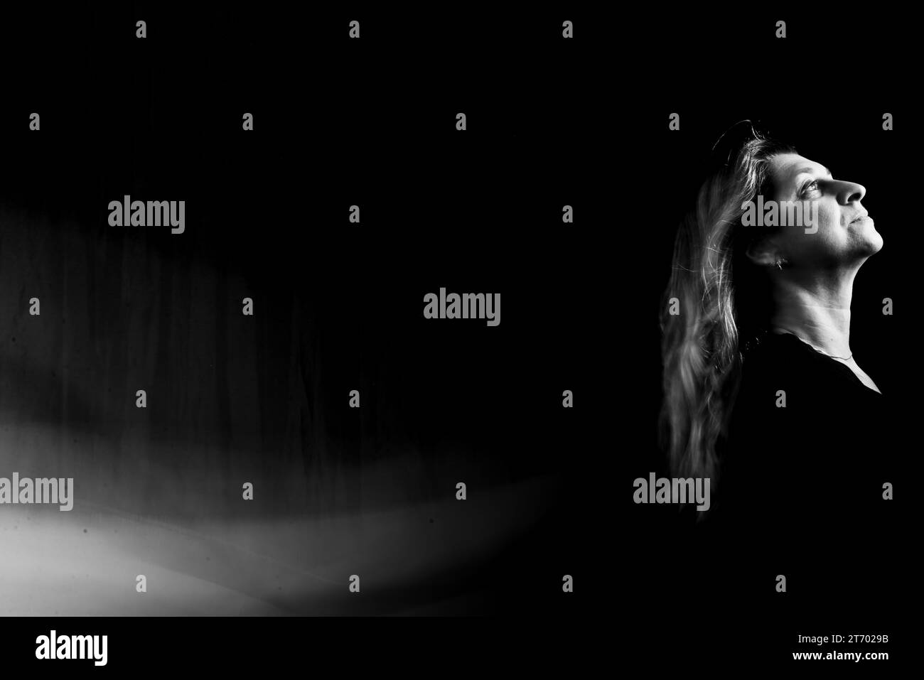 Black and white photo of woman performing in abstract performance with ...