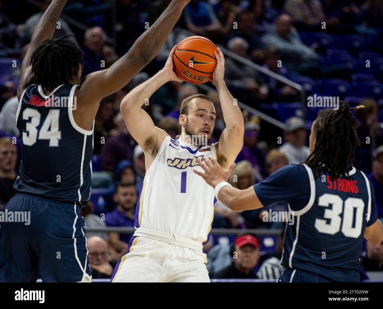 James Madison guard Noah Freidel (1) looks for an opening between ...