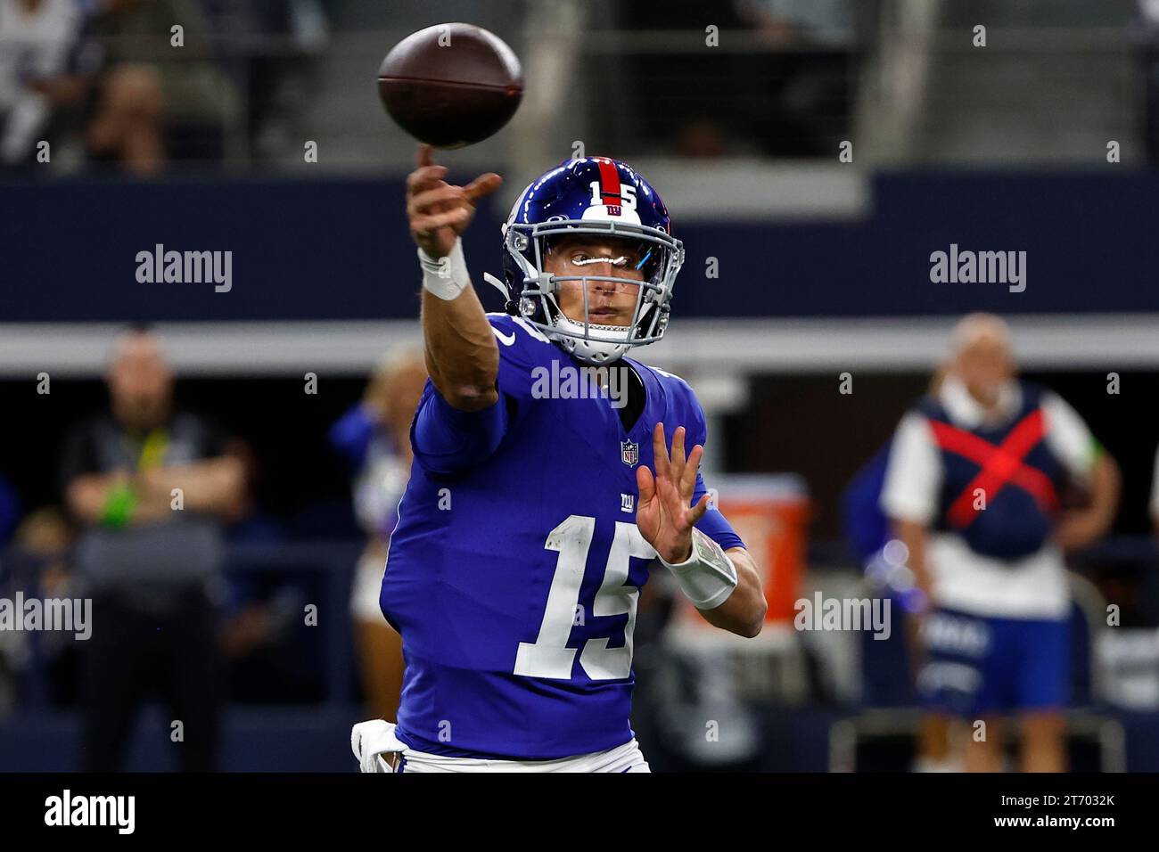 New York Giants quarterback Tommy DeVito (15) throws in the second half ...