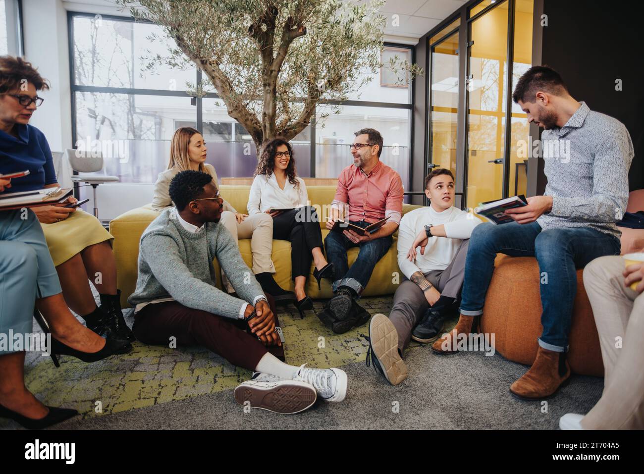 Diverse business team brainstorming and collaborating in modern ...