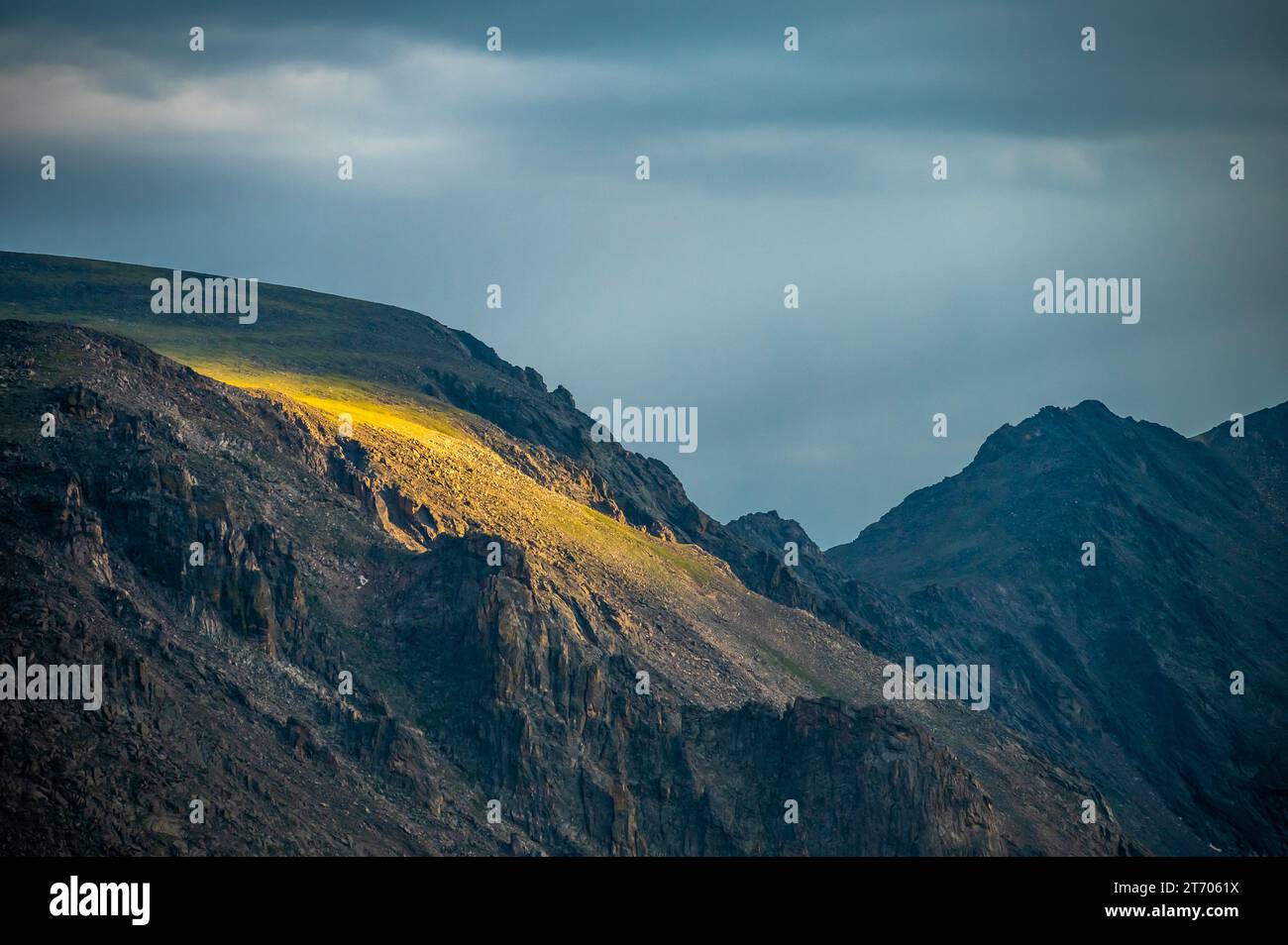 Sunlight Spills Over a Cliff In The Tundra Of Rocky Mountain National ...