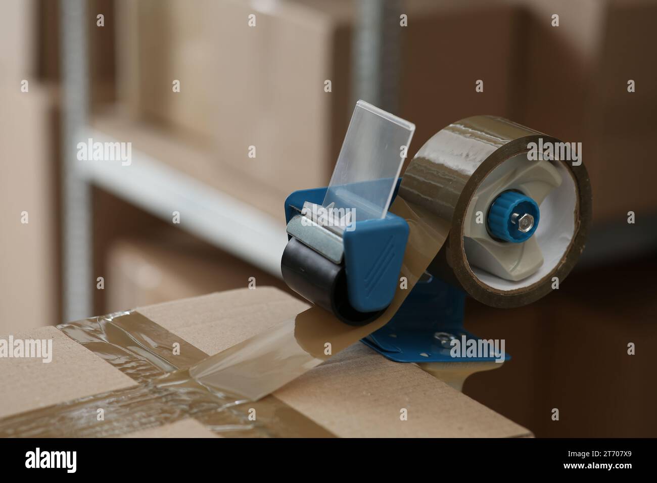 Taping box with adhesive tape dispenser indoors. Space for text Stock ...