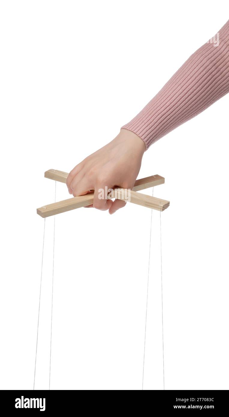 Woman pulling strings of puppet on white background, closeup Stock ...