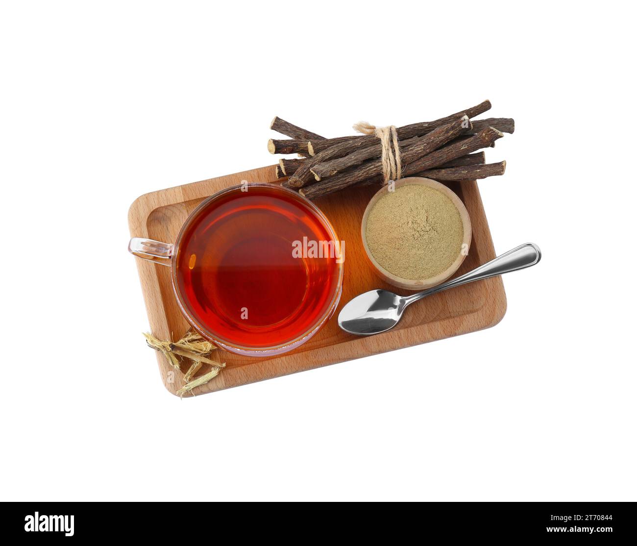 Aromatic licorice tea in cup, dried sticks of licorice root, powder and ...