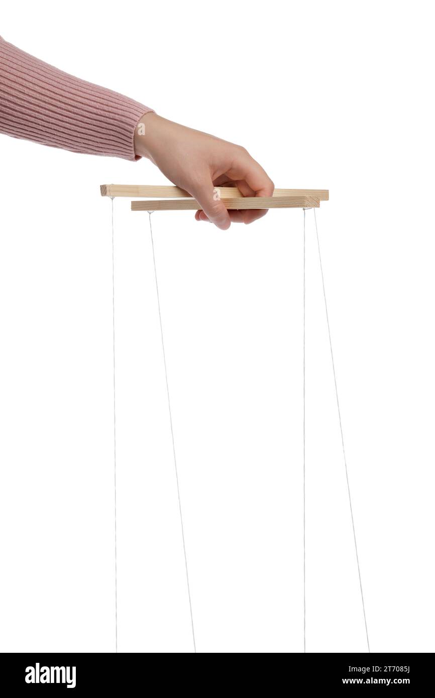 Woman pulling strings of puppet on white background, closeup Stock ...