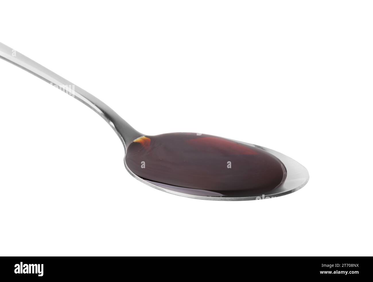Spoon with delicious caramel syrup isolated on white Stock Photo - Alamy
