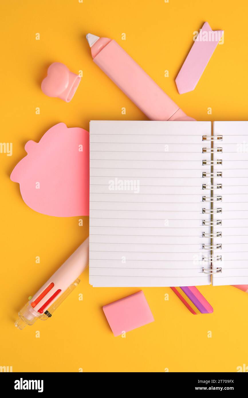 Flat lay composition with open notebook and different school stationery ...