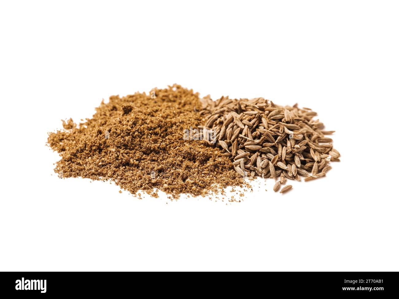 Heaps of aromatic caraway (Persian cumin) powder and seeds isolated on ...