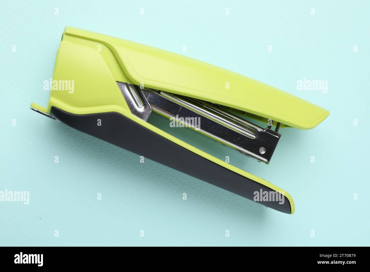 One bright stapler on light blue background, top view Stock Photo - Alamy