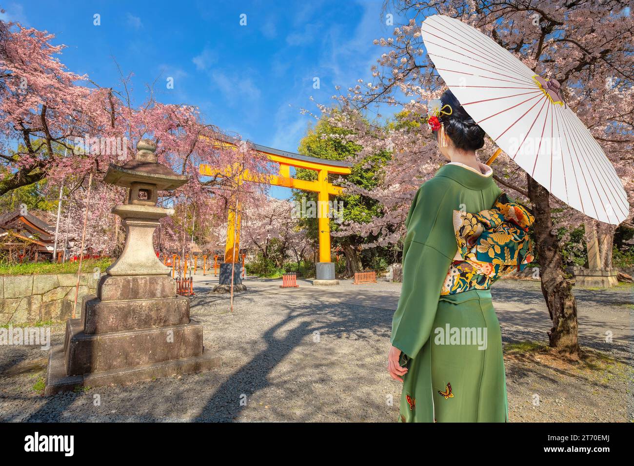 Young Japanese woman in traditional Kimono dress strolls at Hirano ...