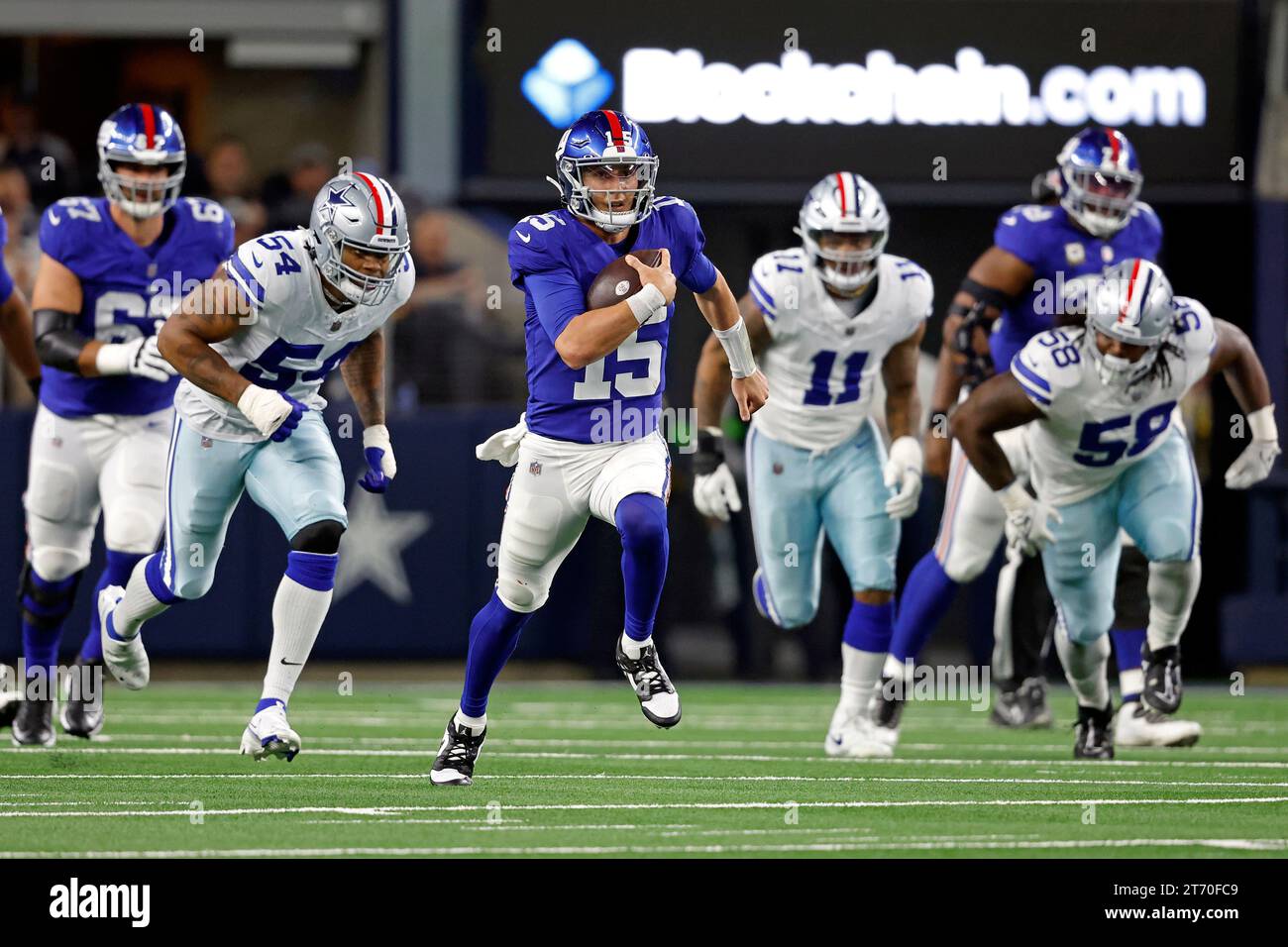 New York Giants quarterback Tommy DeVito (15) runs past Dallas Cowboys ...