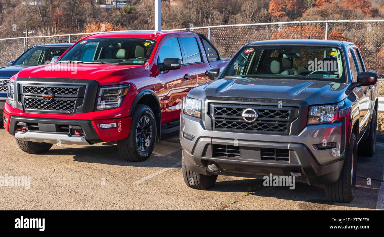 Two Nissan pickup trucks for sale at a dealership in Wilkins Township, Pennsylvania, USA Stock ...