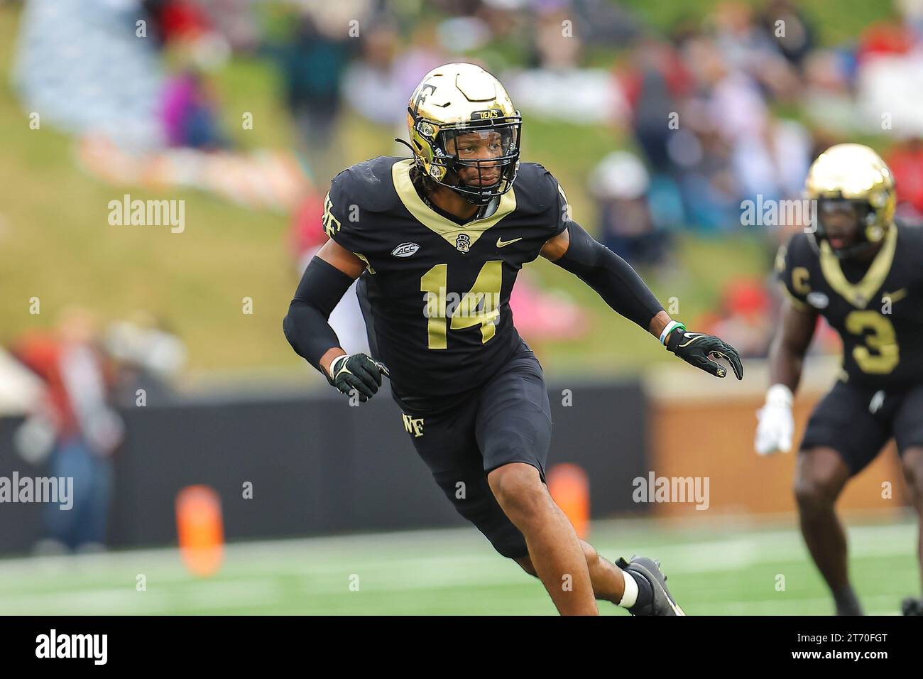 November 11,2023: Wake Forest junior Evan Slocum (14) rushes against NC ...