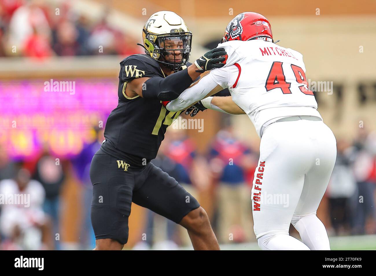 November 11,2023: Wake Forest junior Evan Slocum (14) fights of NC ...