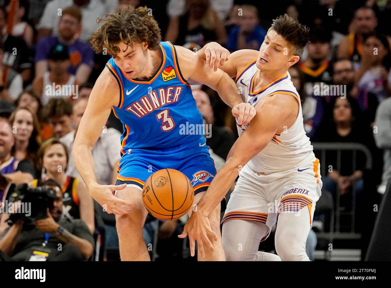 Phoenix Suns' Grayson Allen, right, slaps the ball away from Oklahoma ...
